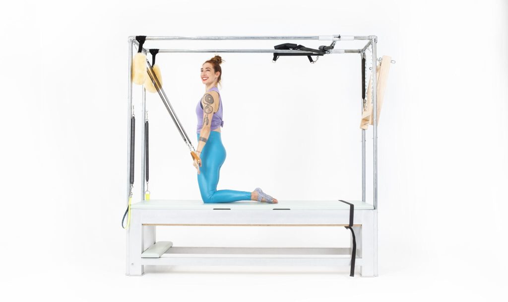 Chest Expansion with Arm Springs on the Cadillac | Online Pilates Classes