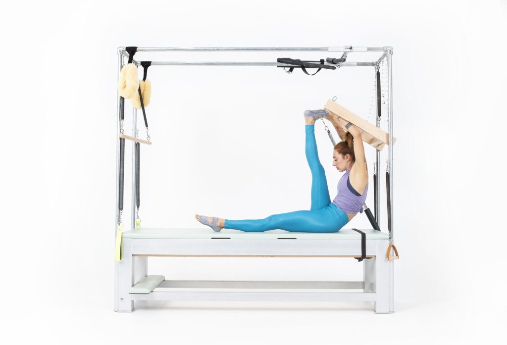 Single Leg Monkey with Push Thru Bar on the Cadillac | Online Pilates ...